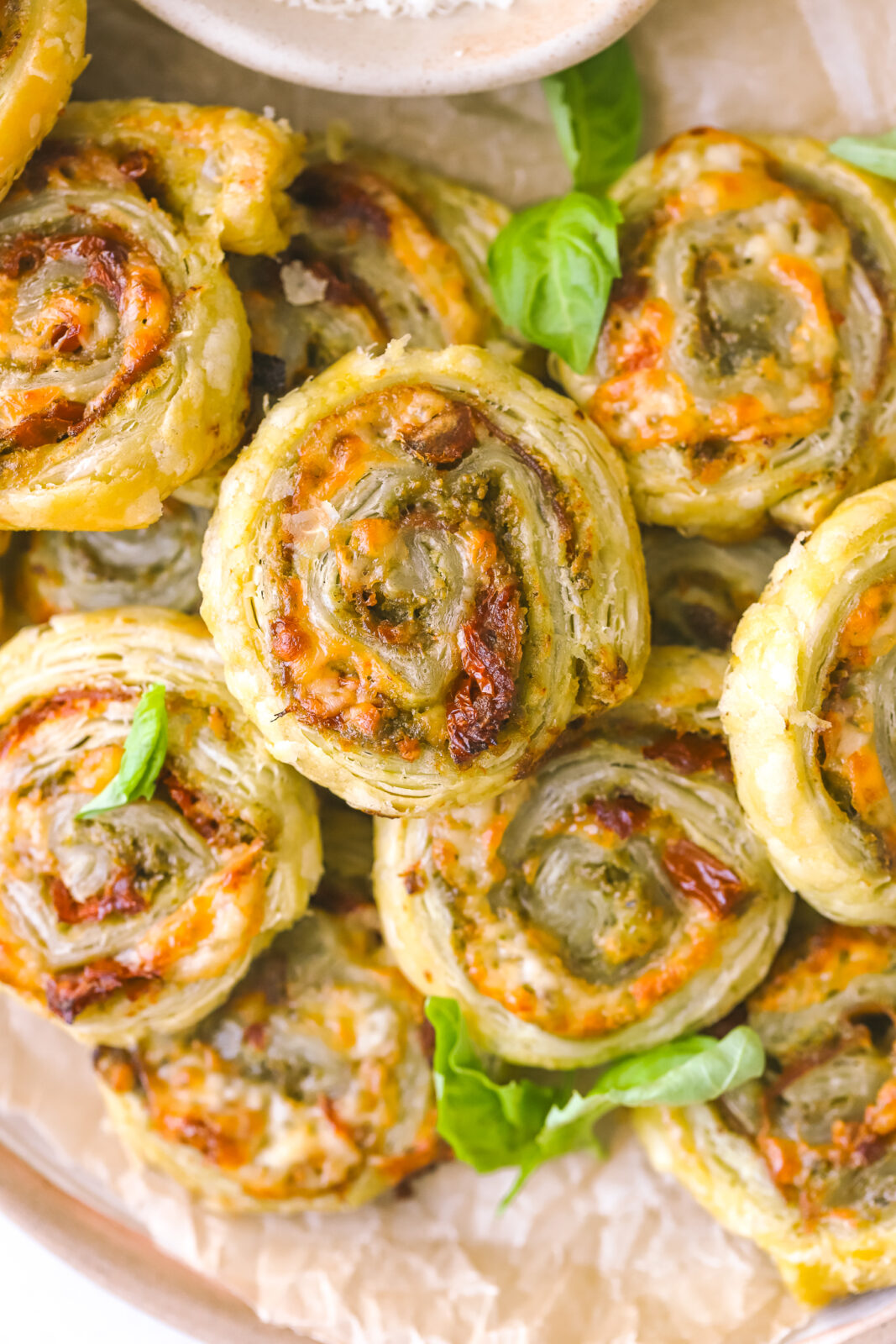 Easy Pesto Puff Pastry Pinwheels with Prosciutto - Cooking in my Genes