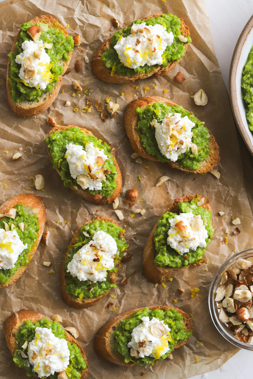 Easy Spring Pea Crostini with Ricotta & Hazelnuts - Cooking in my Genes